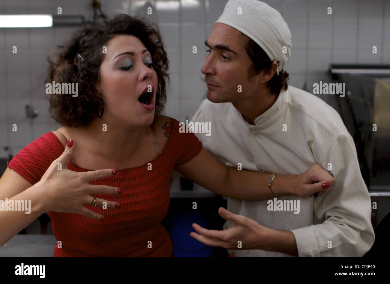 Woman choking kitchen hi-res stock photography and images - Alamy