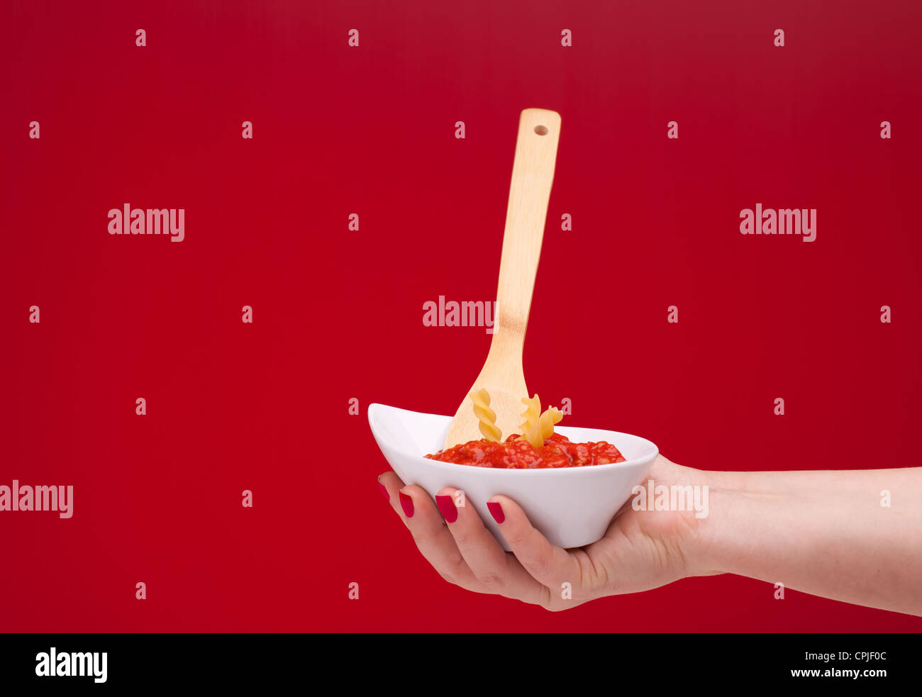 Hand Offering A Bowl With Ragù Stock Photo - Alamy