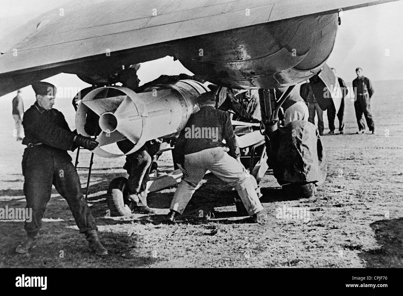 German fighter plane is being loaded with bombs, 1941 Stock Photo - Alamy