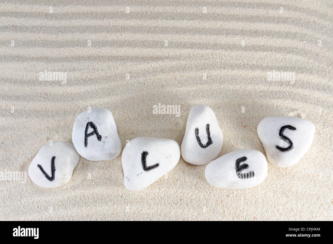 Values Word On Group Of Stones With Sand Background Stock Photo Alamy