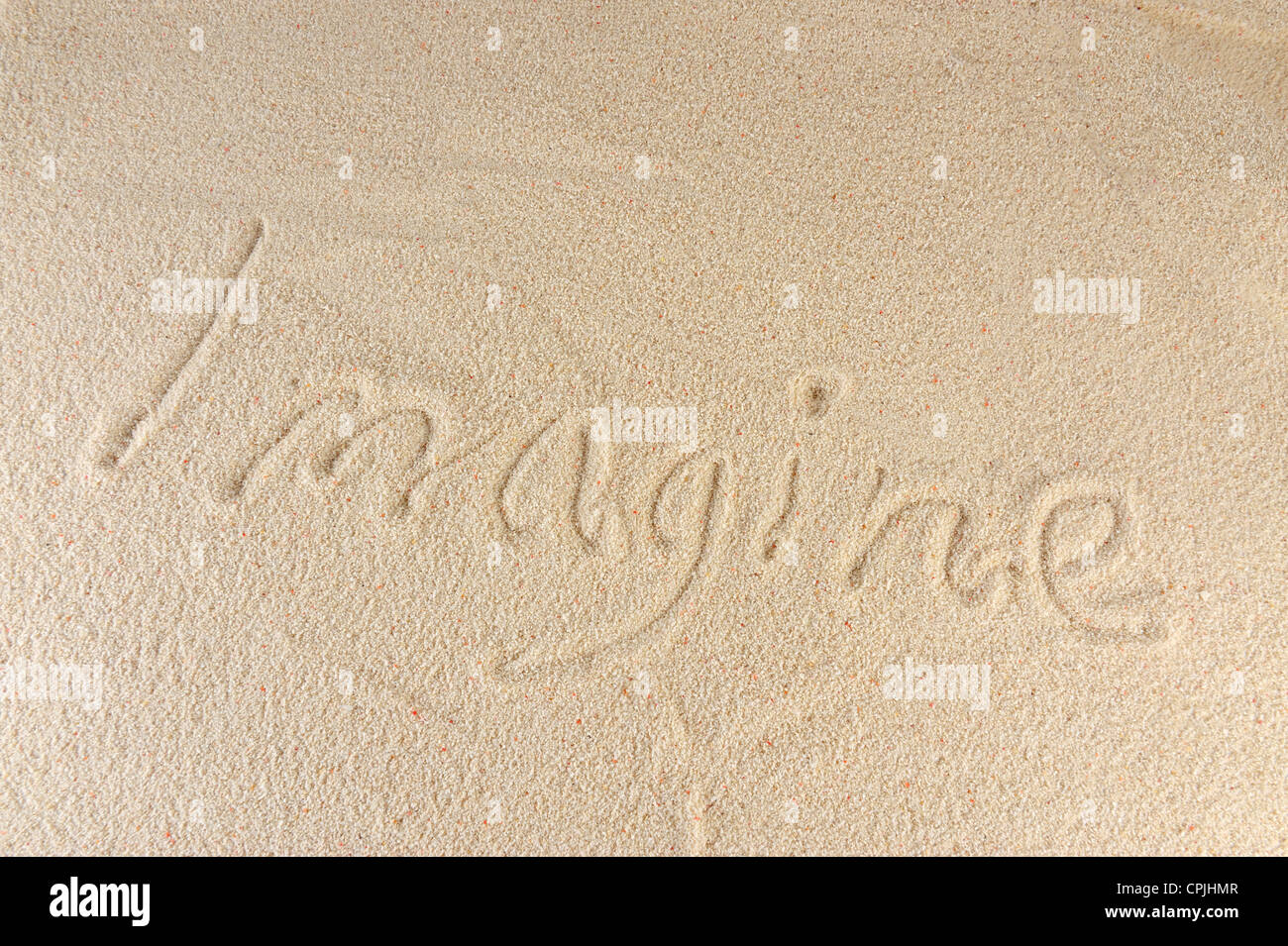 Imagine word written on the sand Stock Photo - Alamy