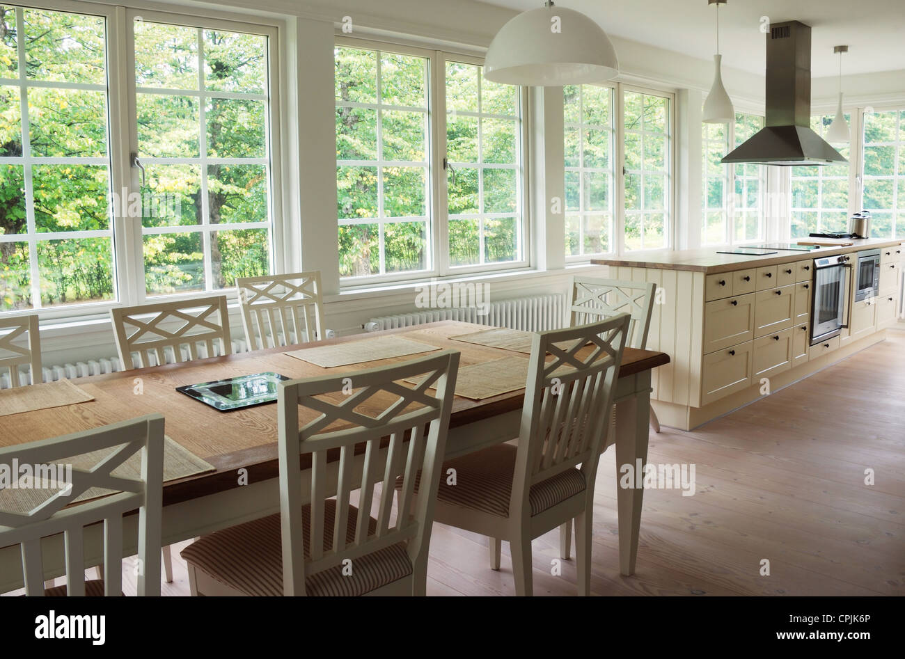 light kitchen interior, chairs, desk, windows Stock Photo - Alamy