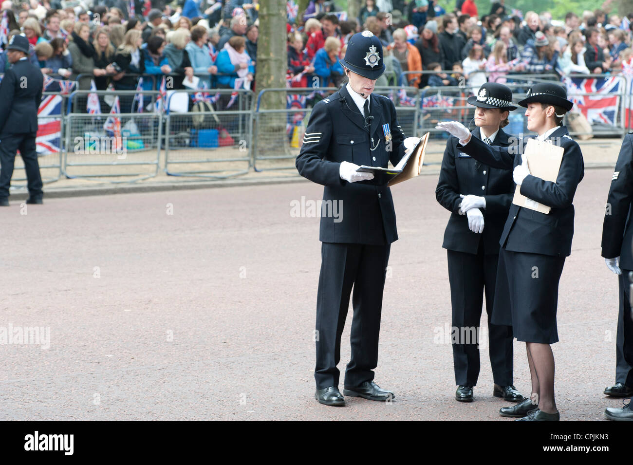 Police officers reviewing orders for the procession of Prince William ...