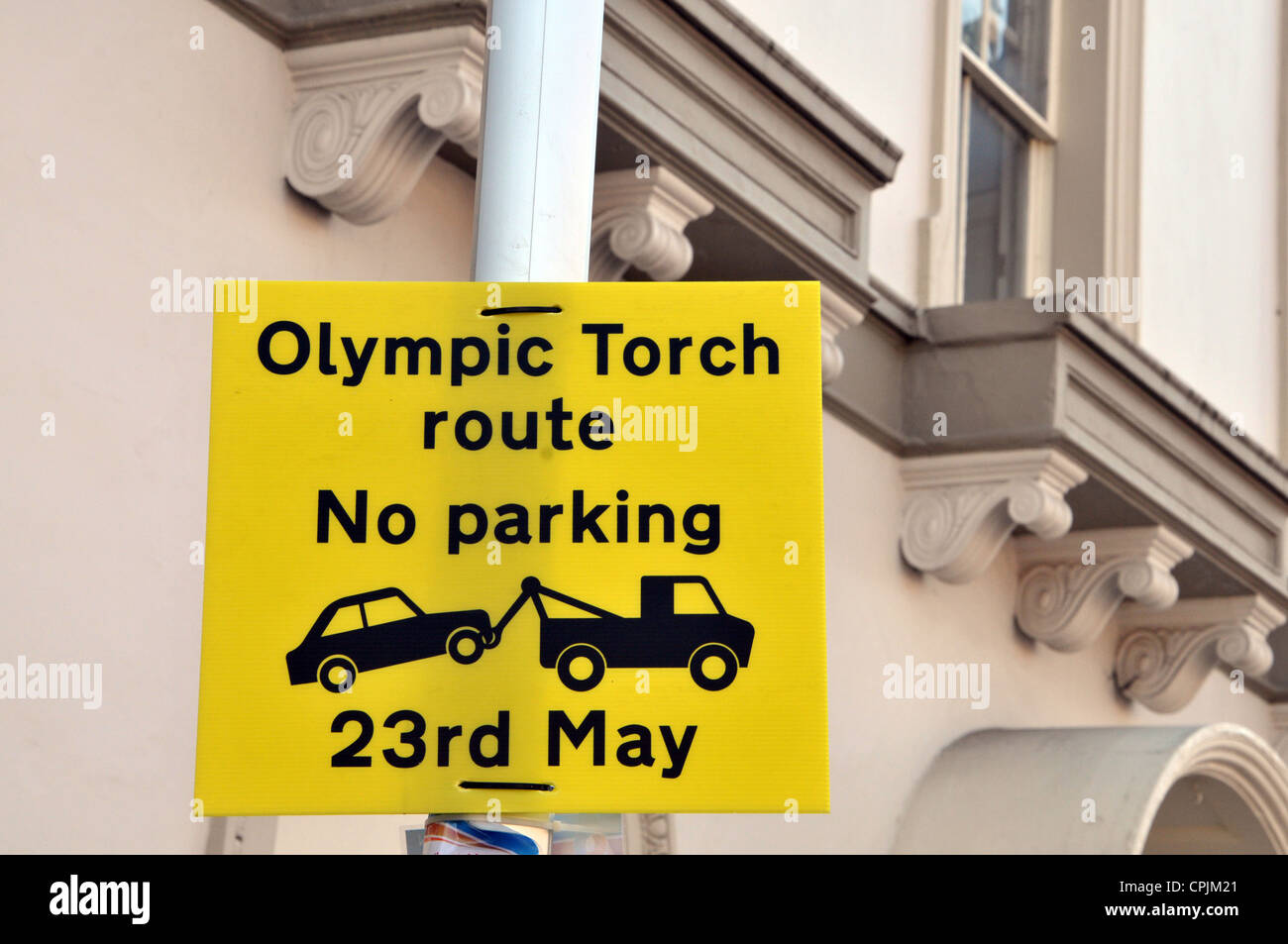 a warning sign posted on the route through the market place of ...