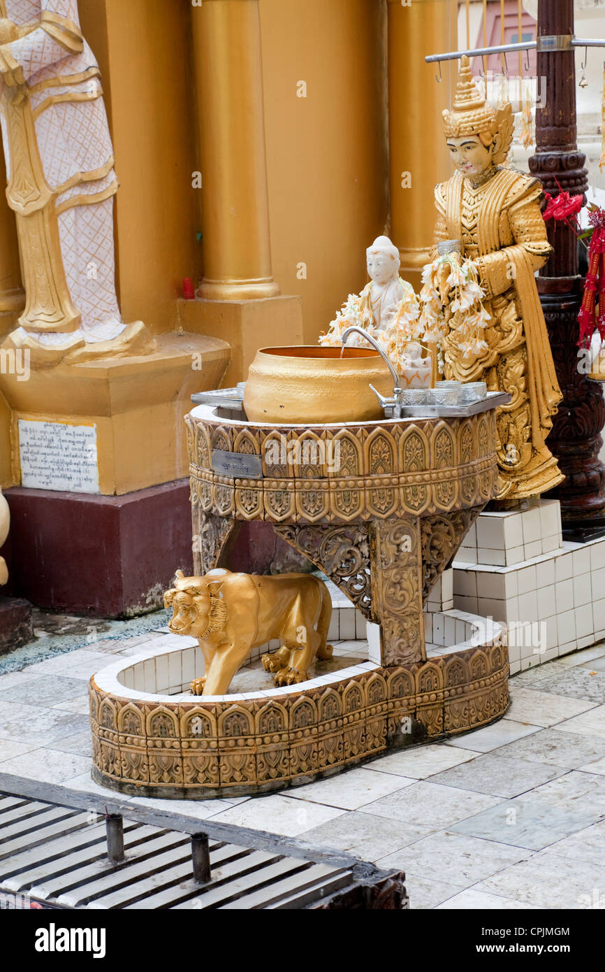 Yangon, Myanmar. A nat, a Buddhist spirit worshiped in Myanmar, stands ...