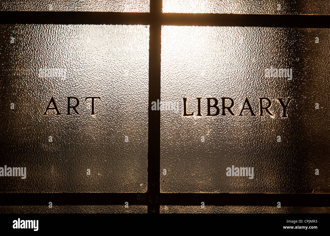 An Art Library sign on a bubble glass window at University of ...