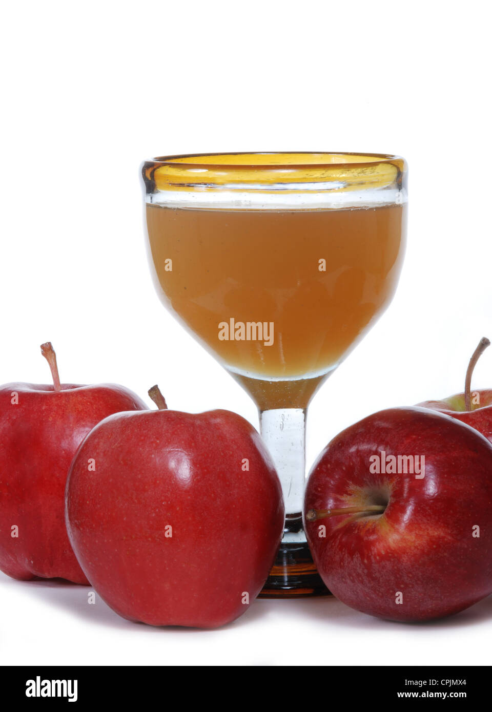 Red apples with a glass of unfiltered organic apple juice Stock Photo ...