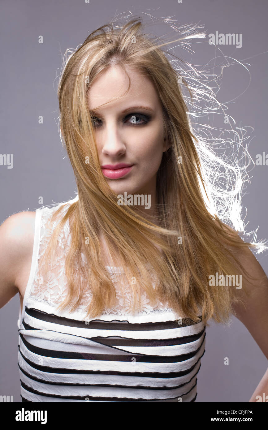 Portrait of a beautiful cool young windswept blond woman Stock Photo ...