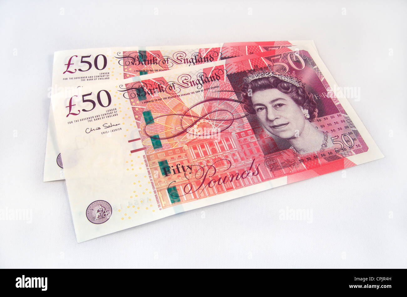 Two fifty pound notes on white background Stock Photo - Alamy