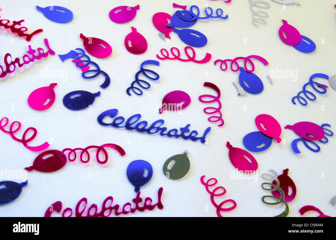 Table confetti saying Celebrate! on white background Stock Photo - Alamy
