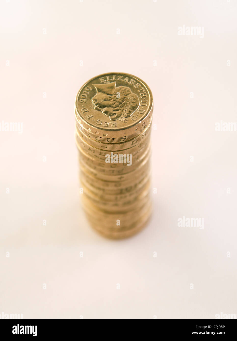 Stack of pound coins on white background Stock Photo - Alamy