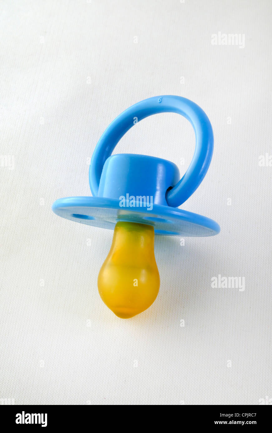 Baby's blue dummy on white background Stock Photo - Alamy