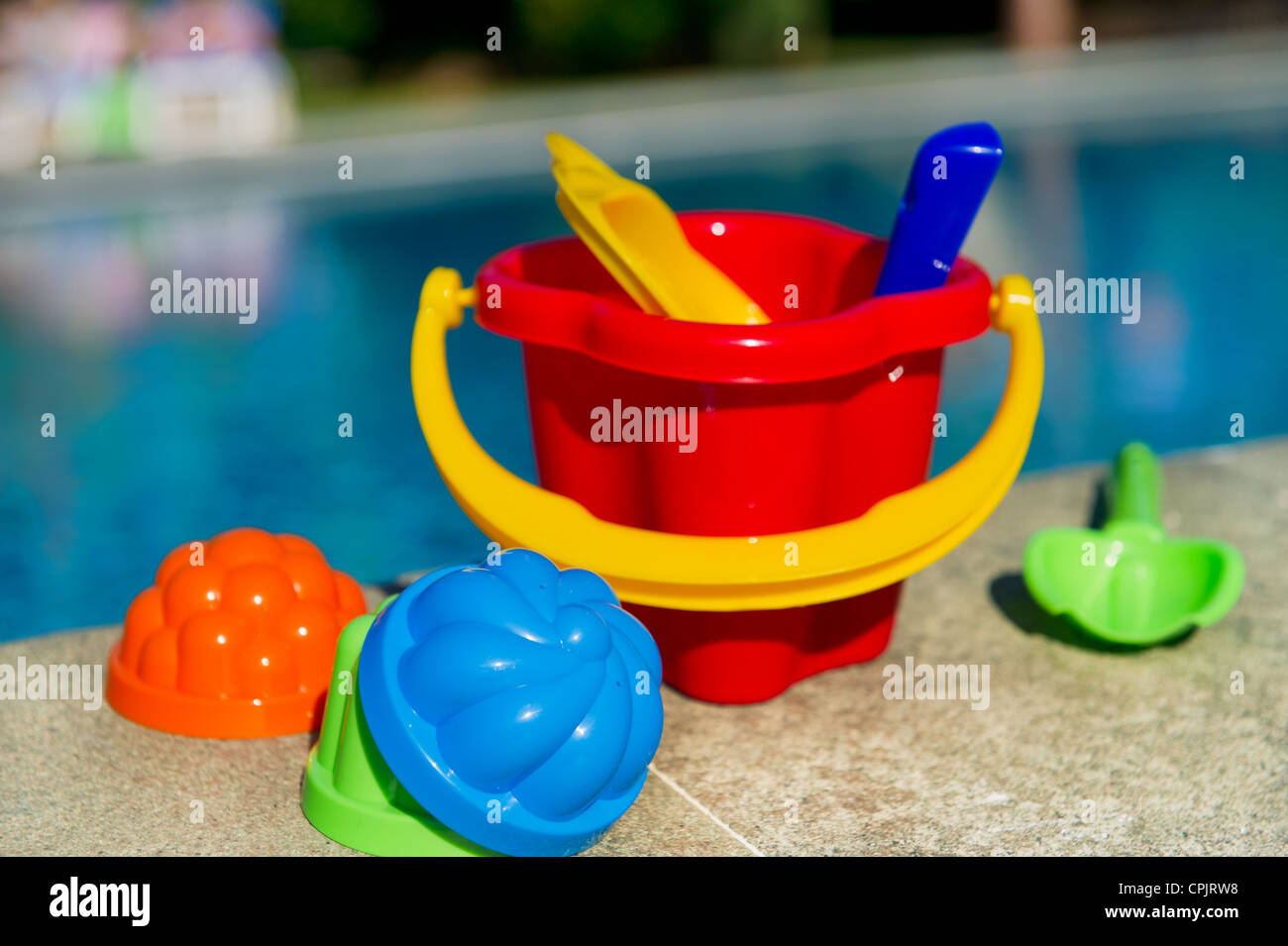 Plastic toys at the swimming pool on vacation Stock Photo - Alamy