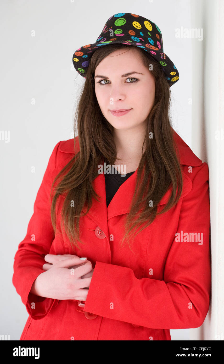 Colorful personality, portrait of a cute confident young student girl in red coat Stock Photo ...