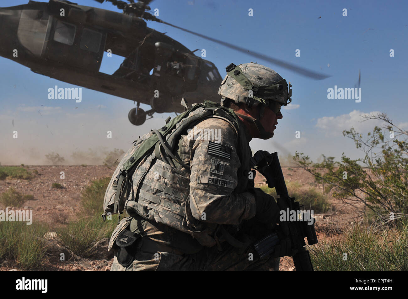 US Army solider moves to secure the landing zone during an air ...