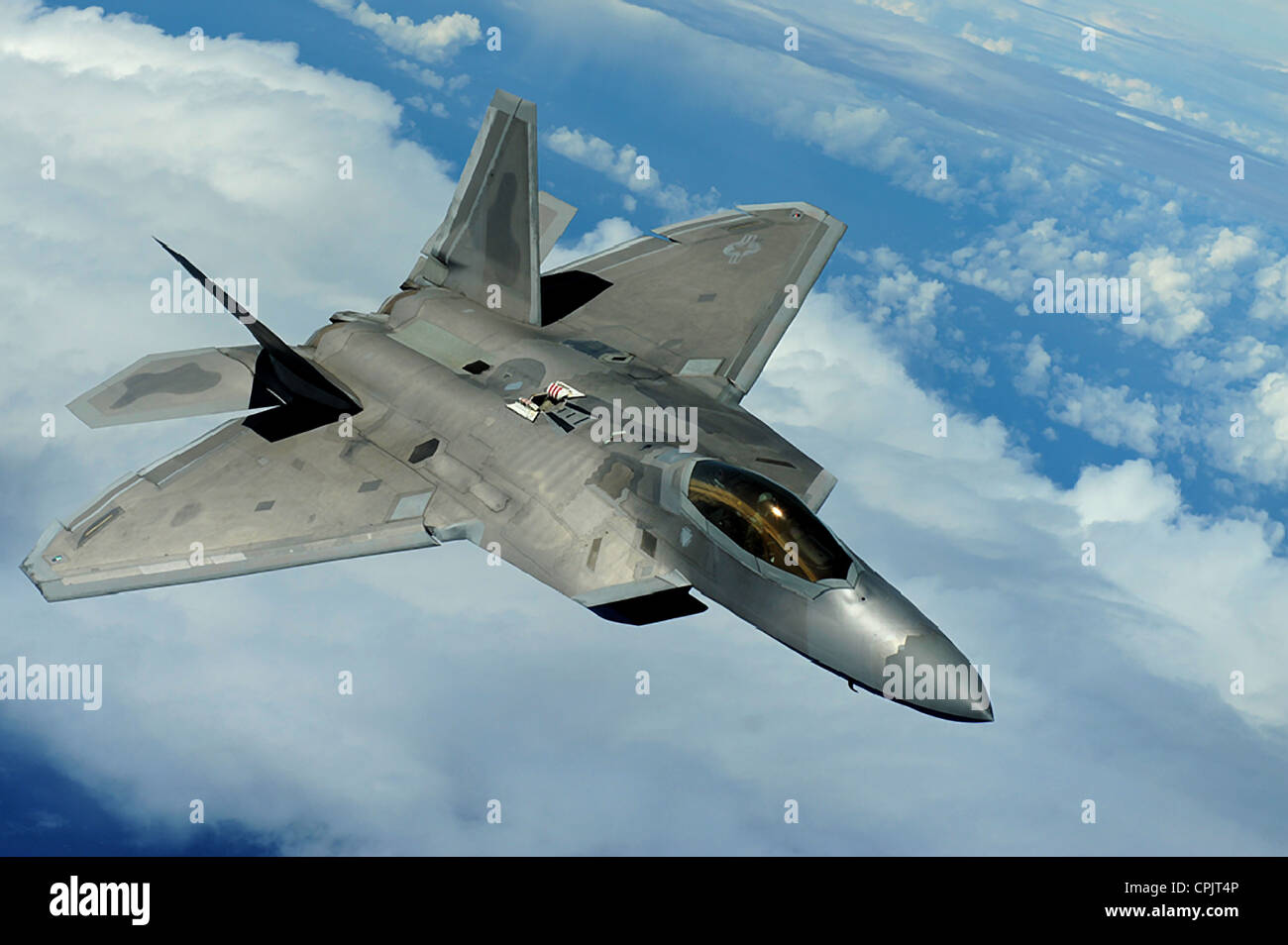 A US Air Force F-22 Raptor conducts training over the Pacific near the ...