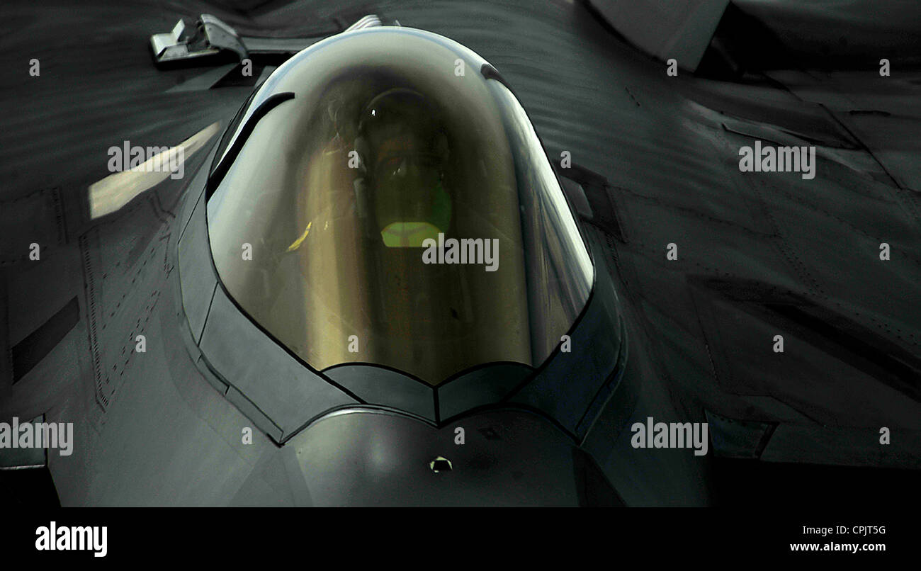 A US Air Force F-22 Raptor pulls into position to refuel from a KC-135 ...