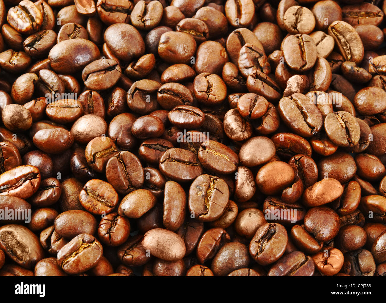 Fried coffee beans - on whole background Stock Photo - Alamy