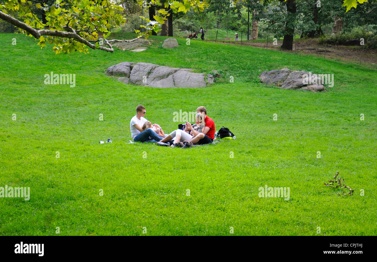 Two couples enjoying the warm weather on a day in Central Park in New ...