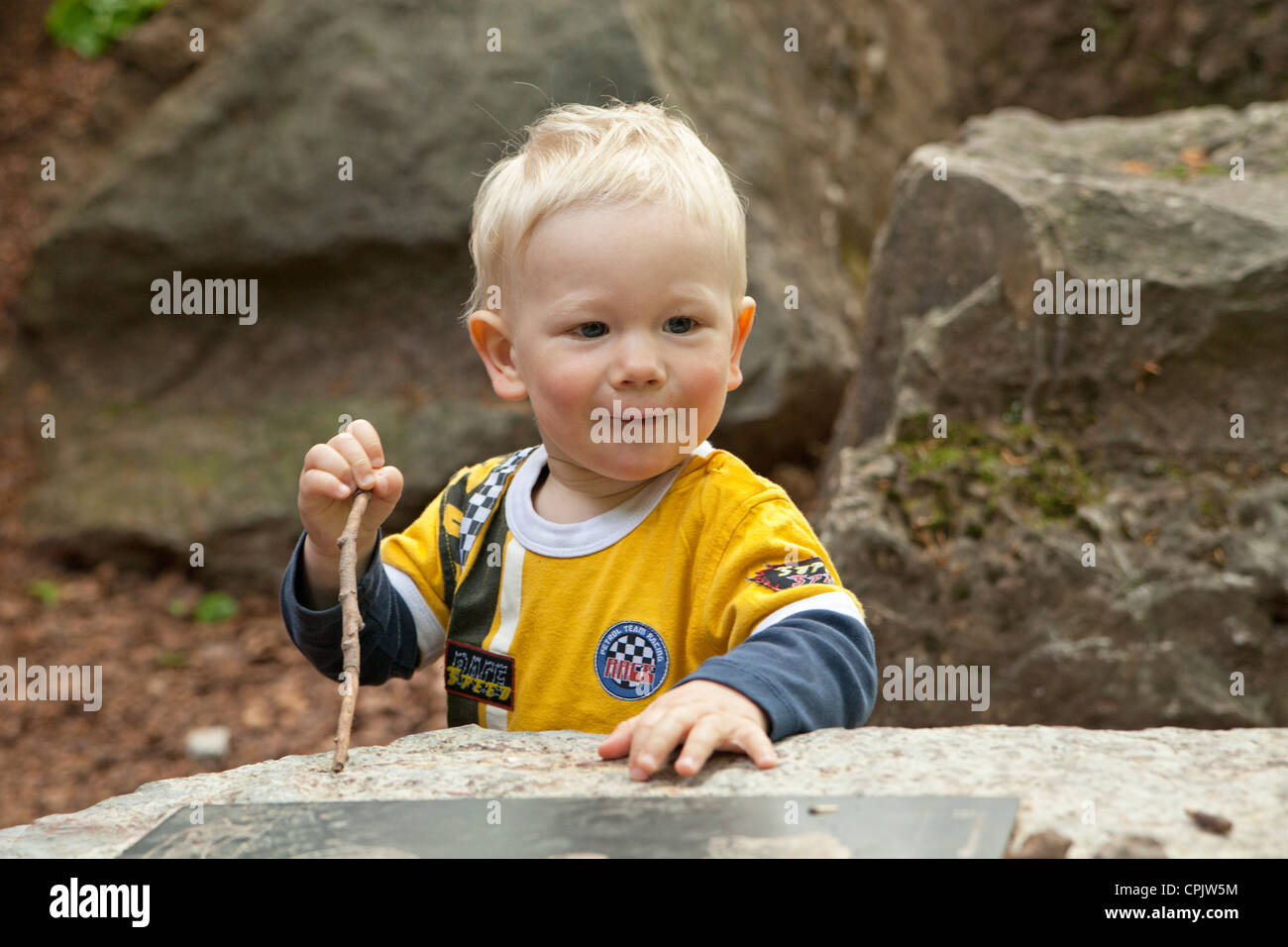Toddler with stick hi-res stock photography and images - Alamy