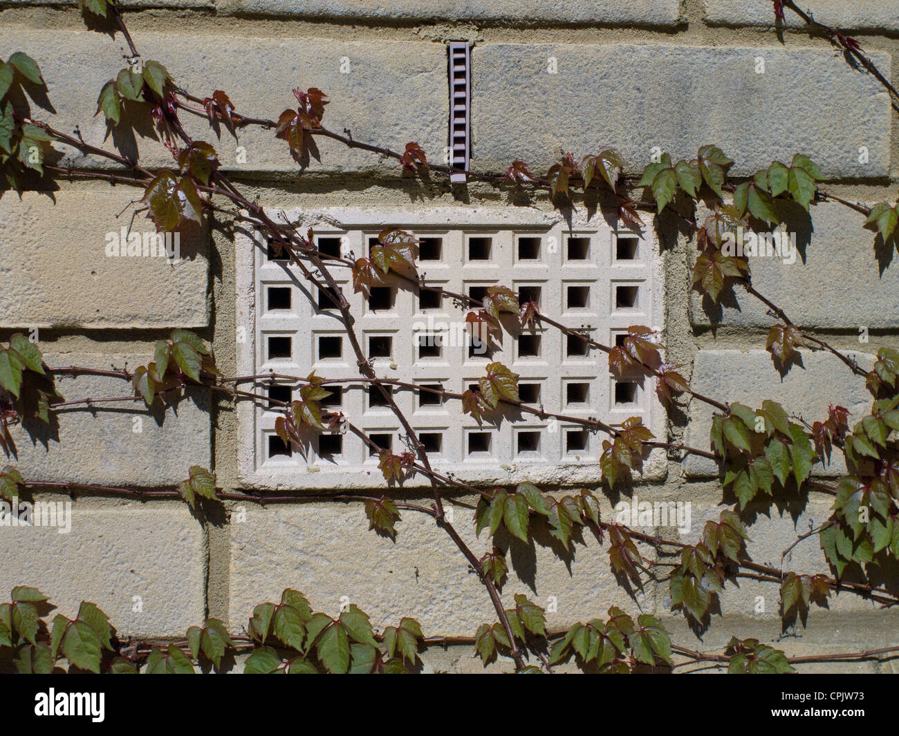 A partially obstructed ventilation block in a brick wall Stock Photo ...