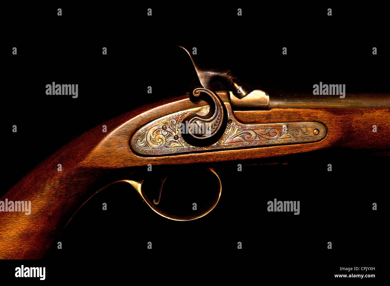 old gun isolated on a black background Stock Photo - Alamy