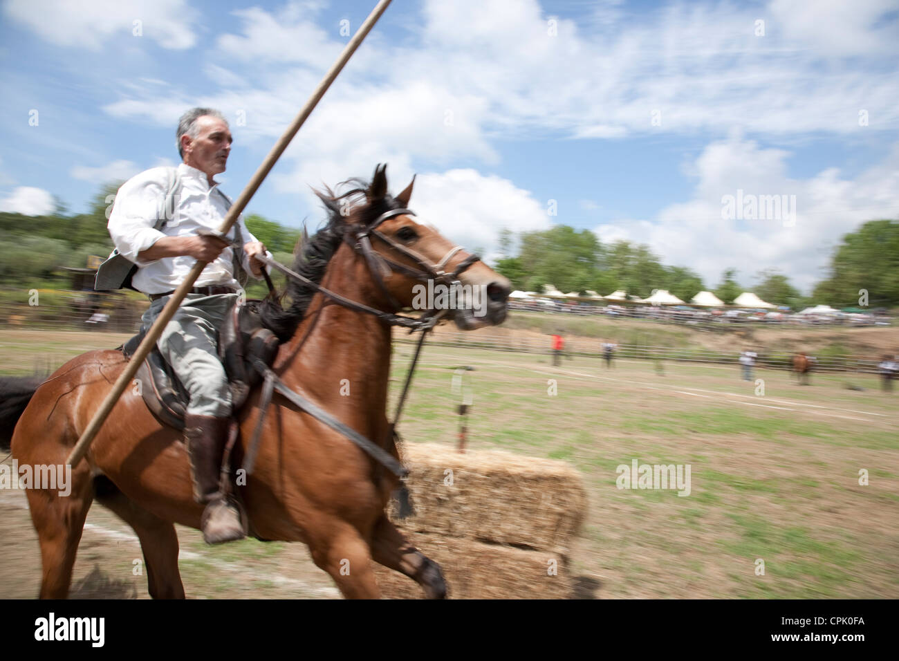 A 'Buttero' cowboy participating in a ranching tournament in Canale ...