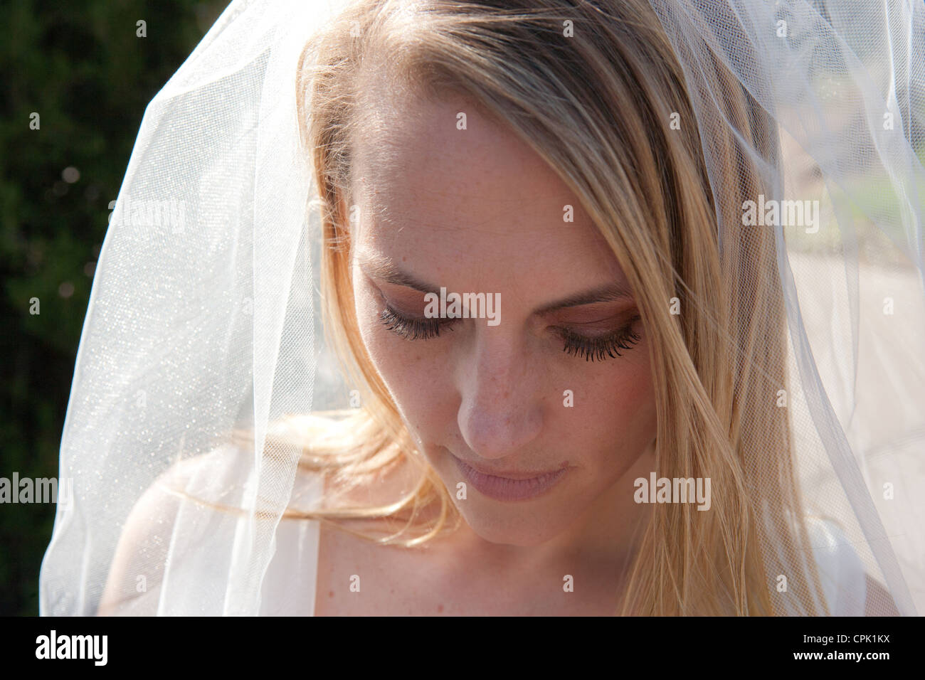 Bride looking down Stock Photo - Alamy