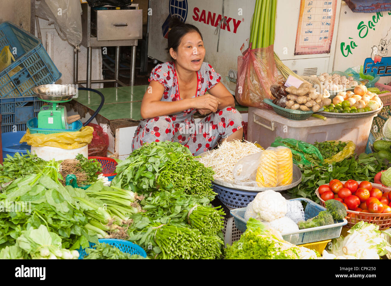 Market trader selling vegetables inside Ben Thanh Market, Ho Chi Minh ...