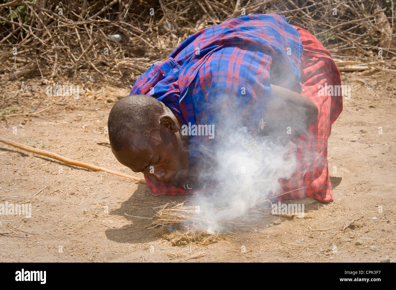 Masai creating fire Stock Photo - Alamy