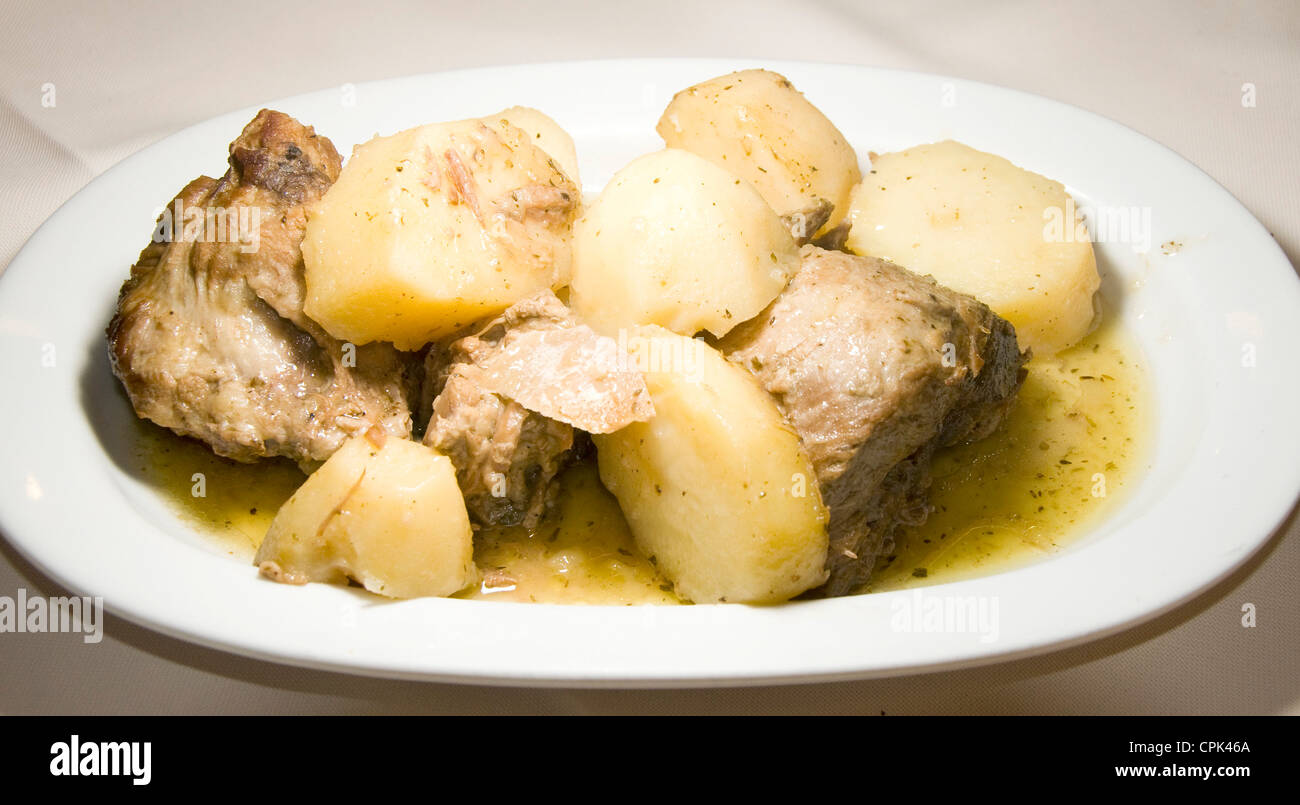 Greek food lamb lemon sauce with potatoes traditional taverna food as ...