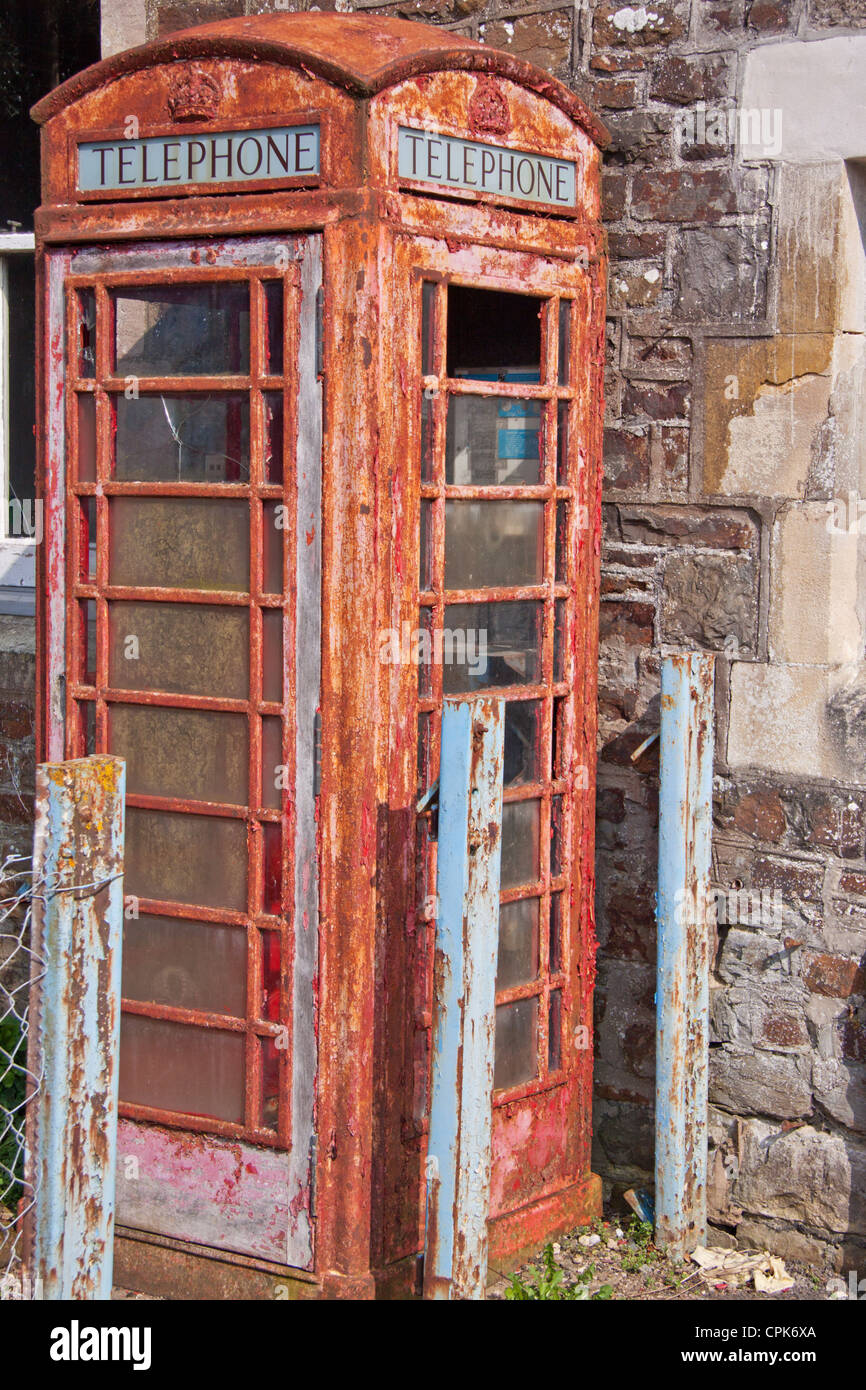 Derelict traditional red UK public telephone box, originally designed by Sir Giles Gilbert Scott ...