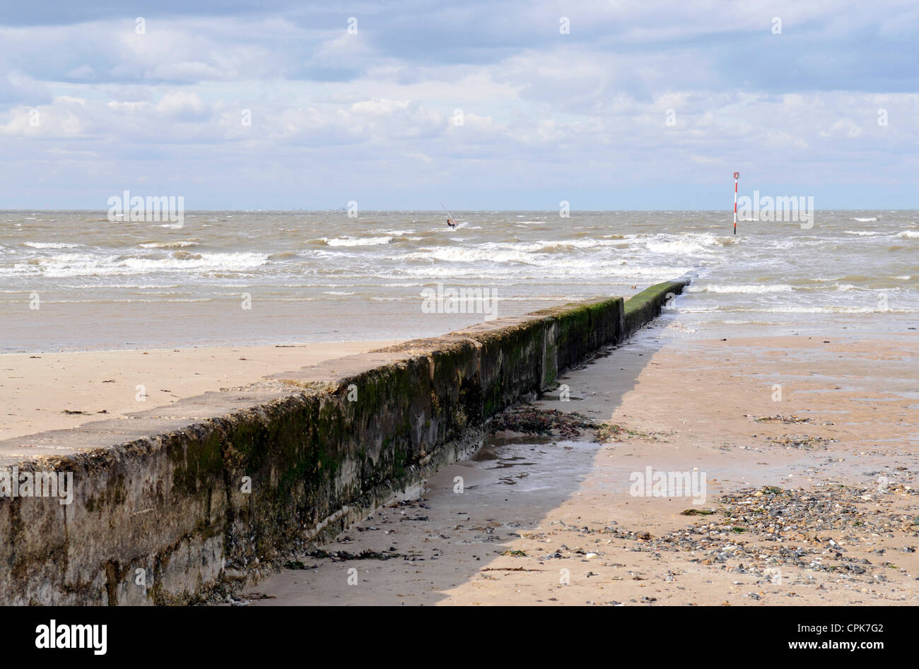 Sea wall leading into Thames Estuary at Minnis Bay, Kent Stock Photo ...