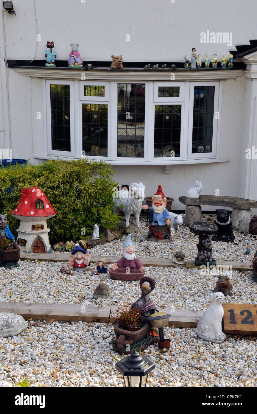 Garden gnomes and ornaments in front garden of suburban house Stock ...