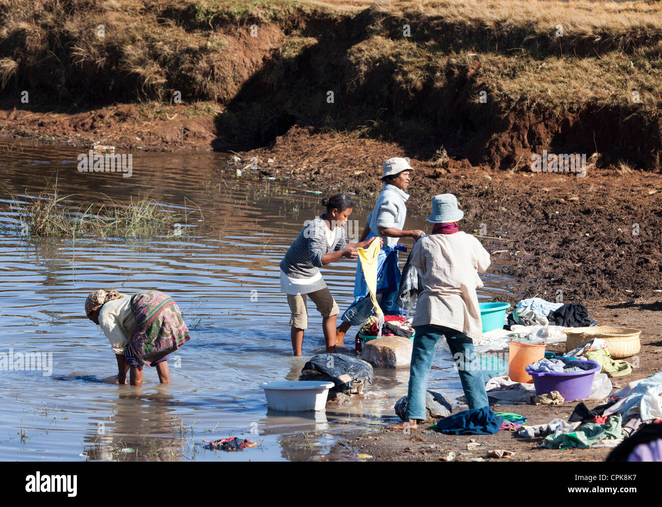 Women washing clothes in lake hi-res stock photography and images - Alamy