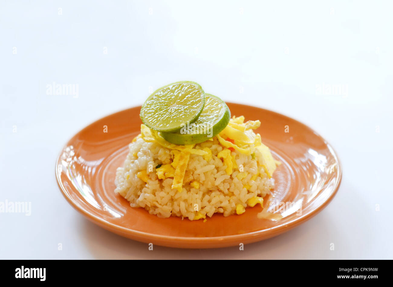 fried rice served with omelet slice and lemon slice Stock Photo - Alamy
