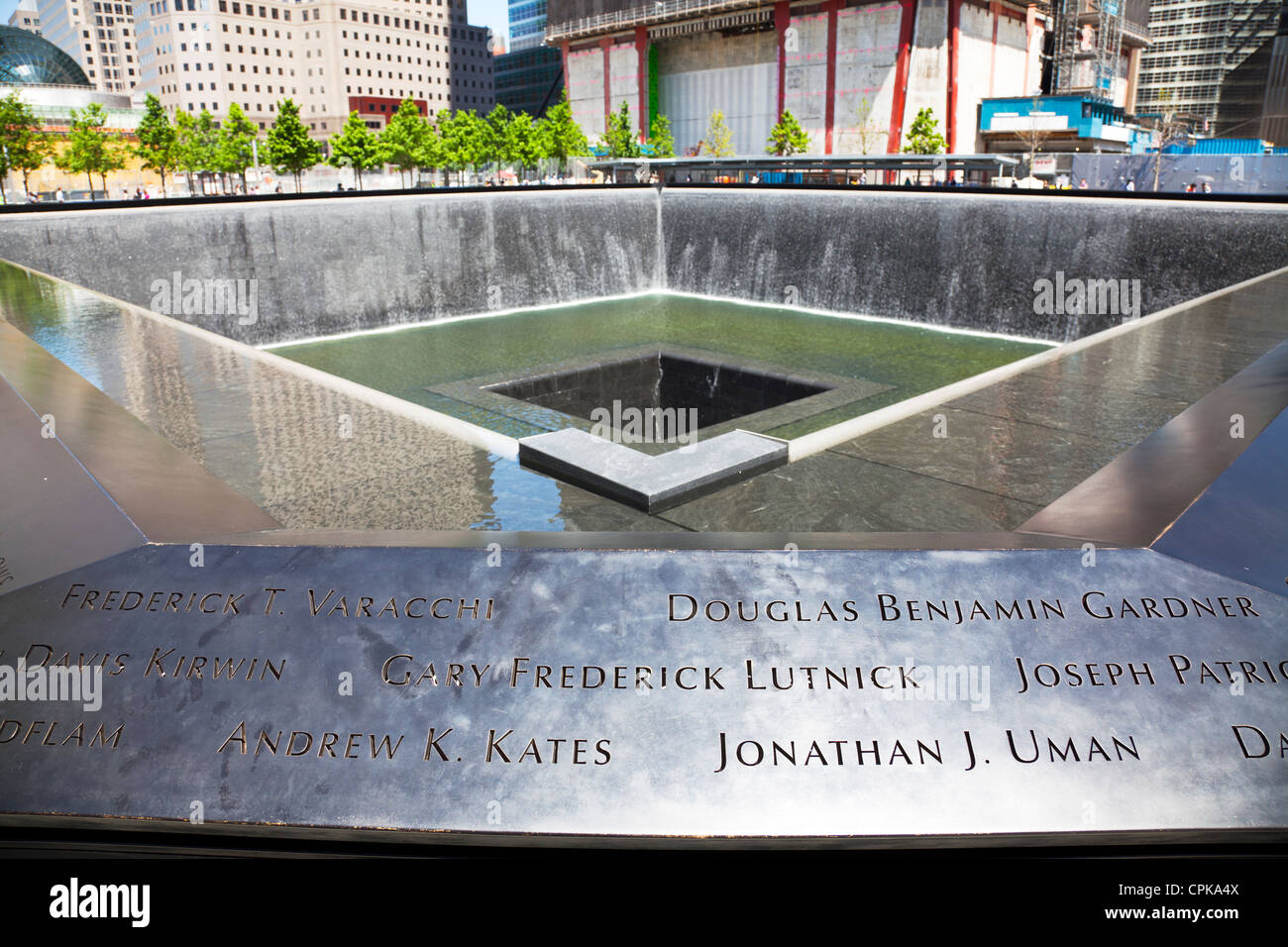 9/11 memorial at ground zero, waterfalls with names inscribed around ...