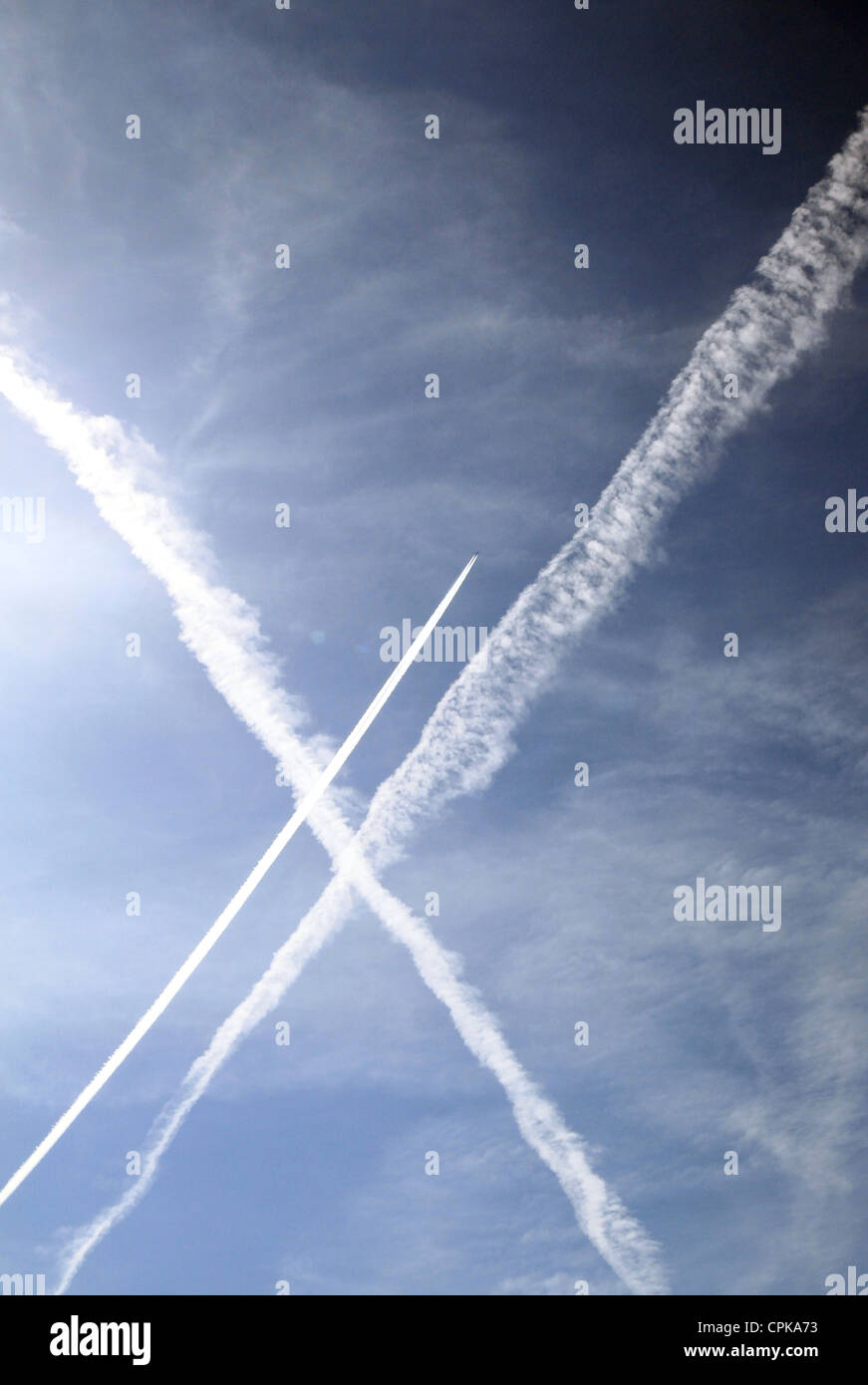 White airplane route signs in a blue sky Stock Photo - Alamy