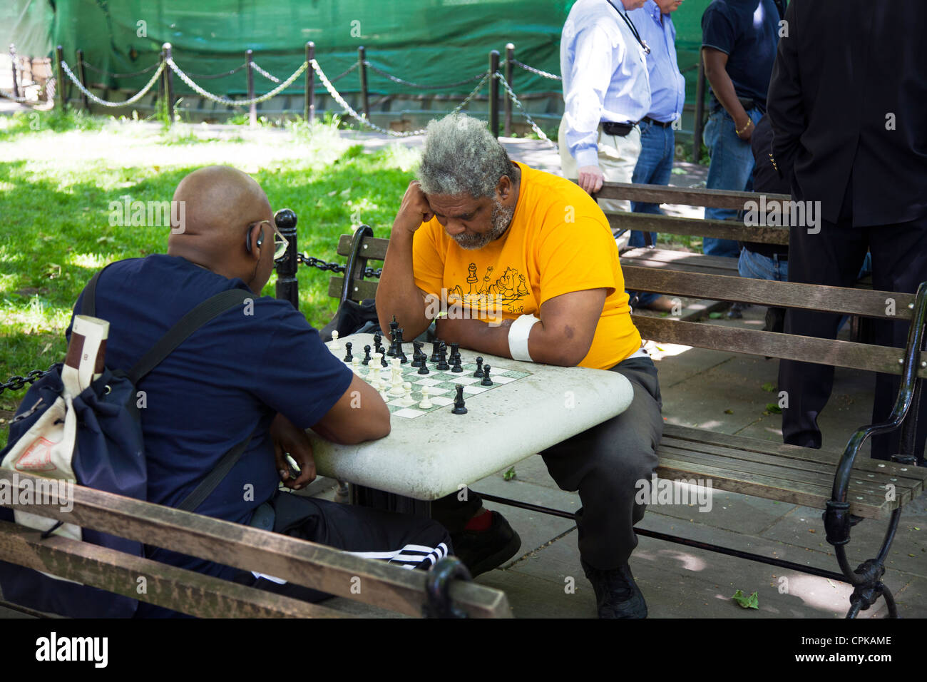 Men playing chess game in park in New York in Steve Flanders Square in ...