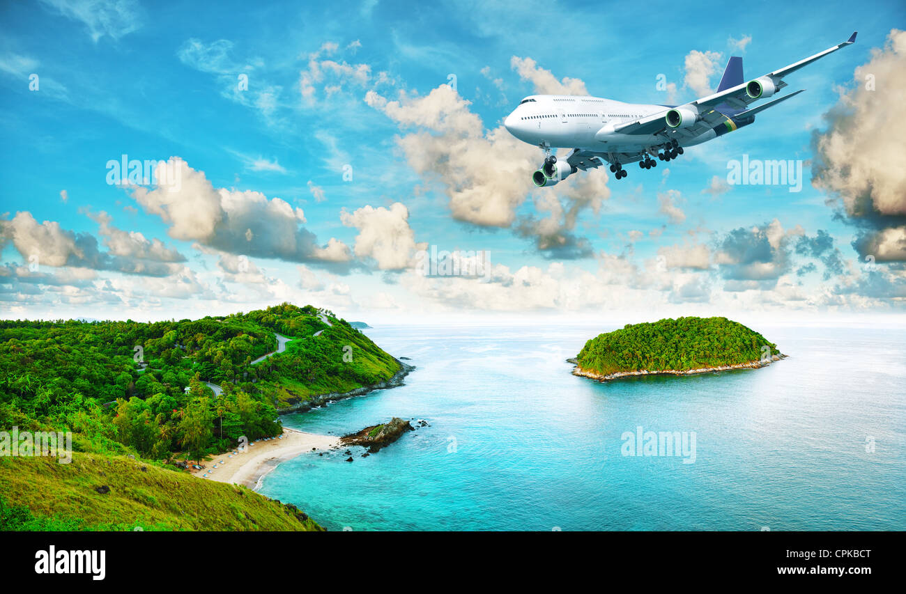 Jet plane over the tropical island. Panoramic composition in very high ...