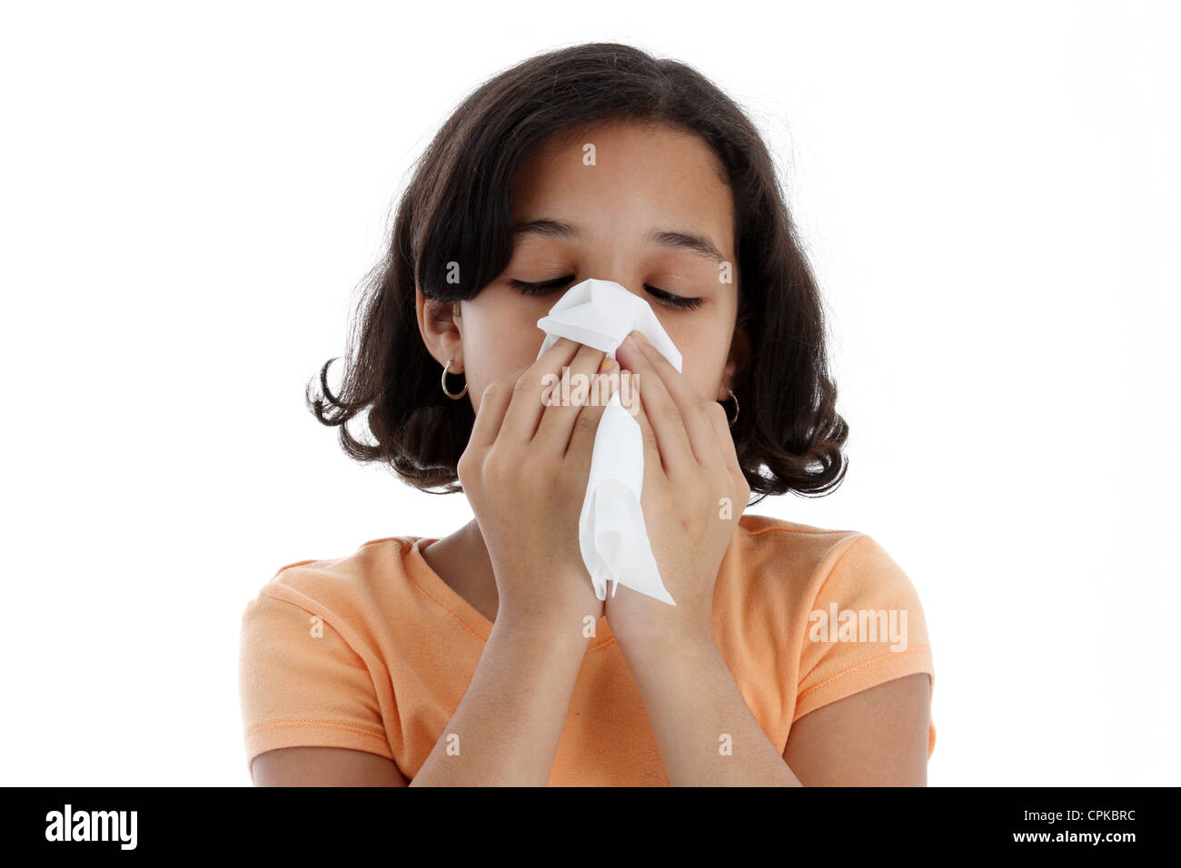 A young girl with tissue and a cold Stock Photo - Alamy