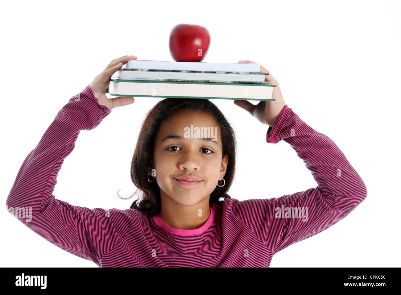 Student with books and an apple Stock Photo - Alamy