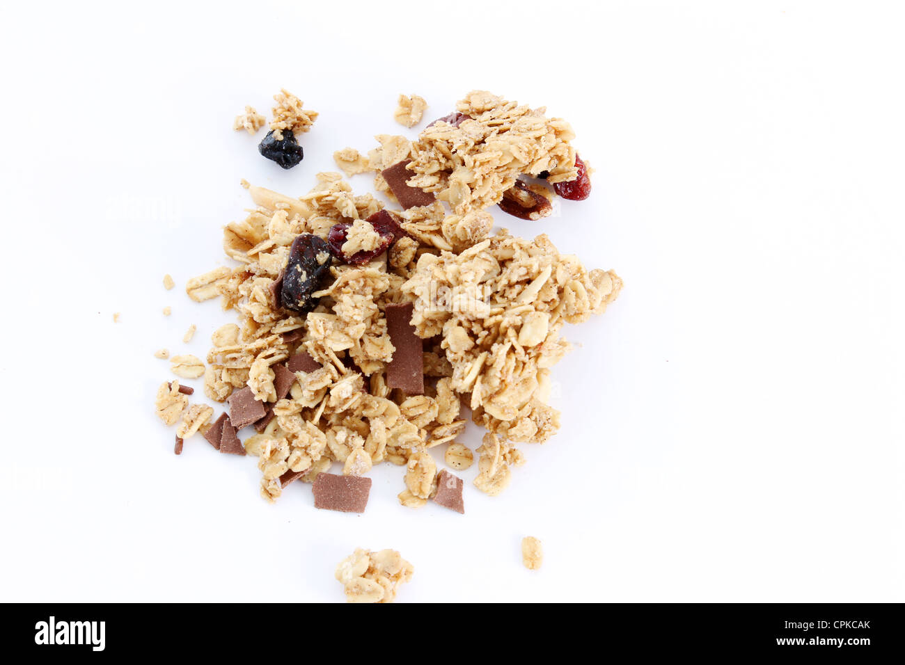 Fruit and nut granola mix on white background Stock Photo - Alamy