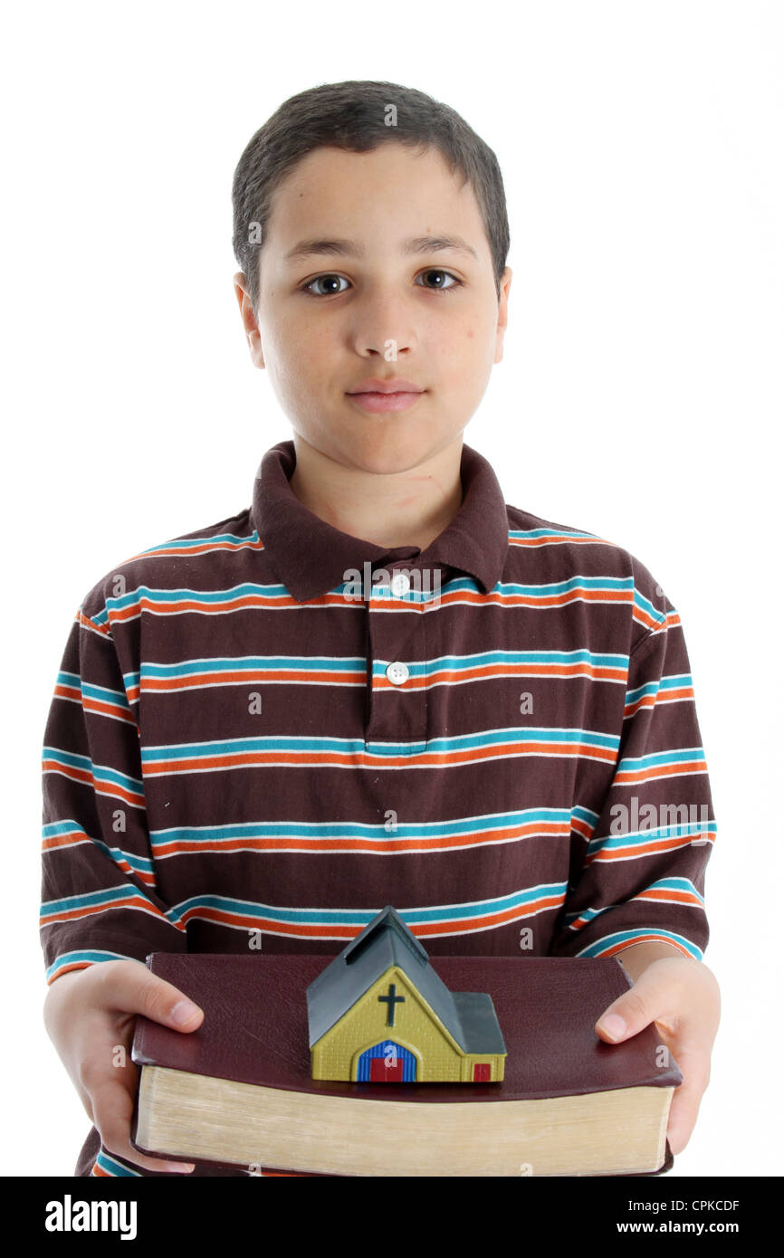 Picture of a child with a Bible set on white background Stock Photo - Alamy