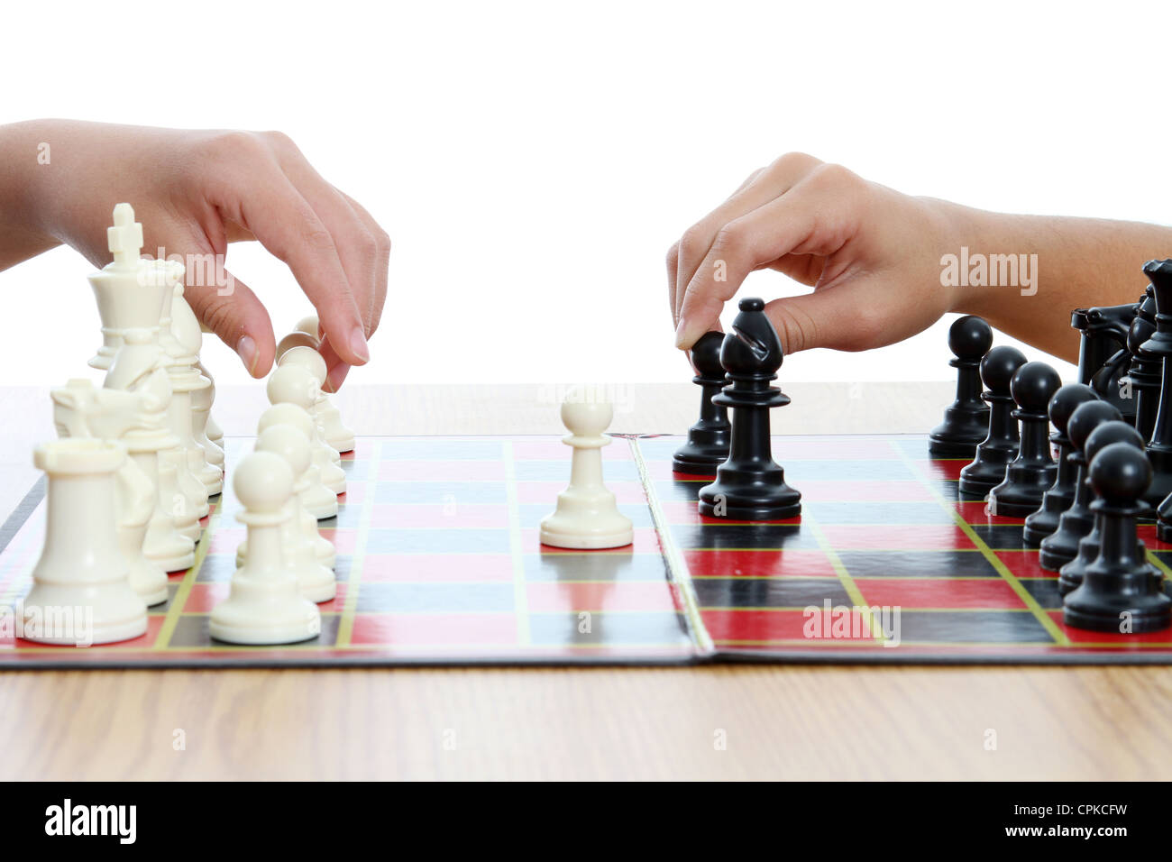 Picture of children playing chess set on white background Stock Photo ...