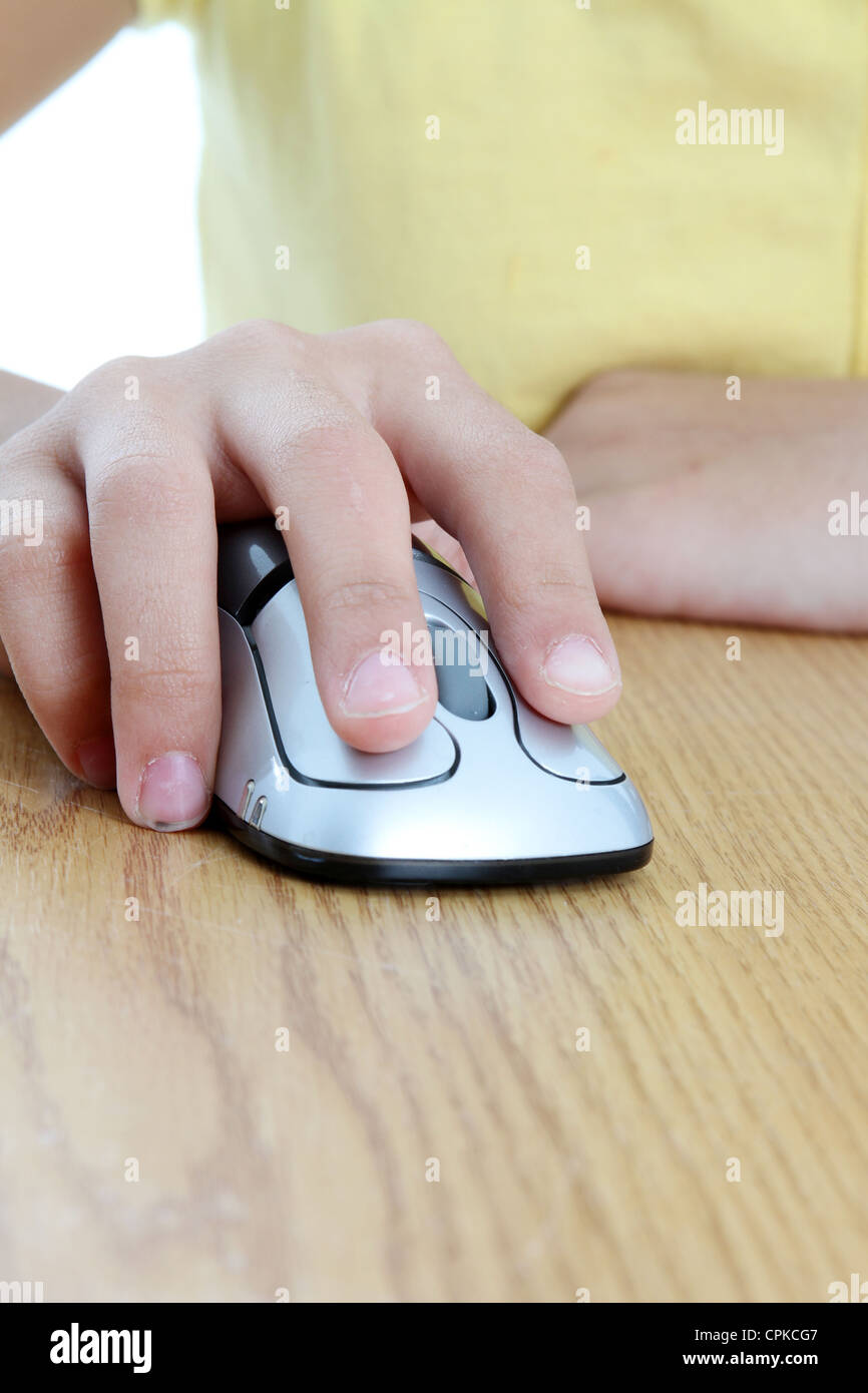 Picture of a child with computer mouse set on white background Stock ...