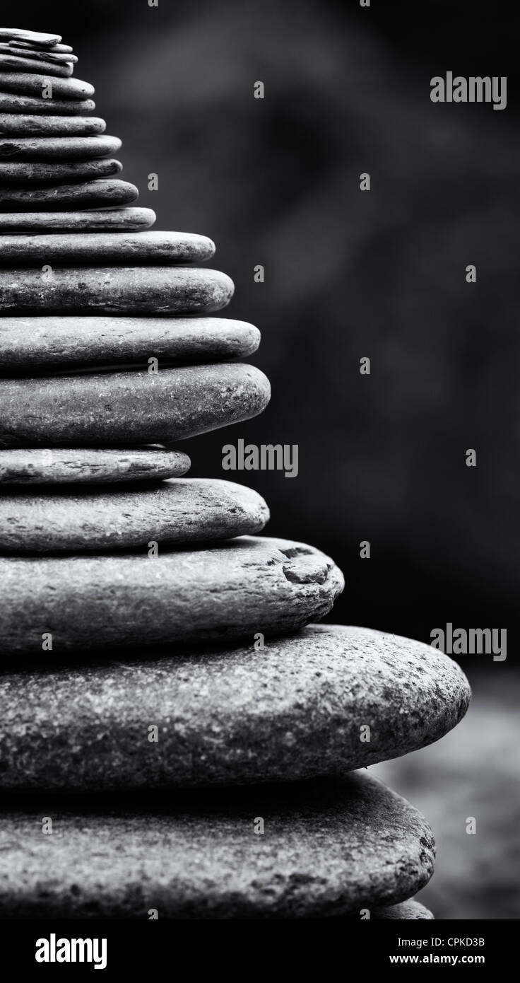 Stacked pebbles in a pyramid shape. Monochrome Stock Photo - Alamy