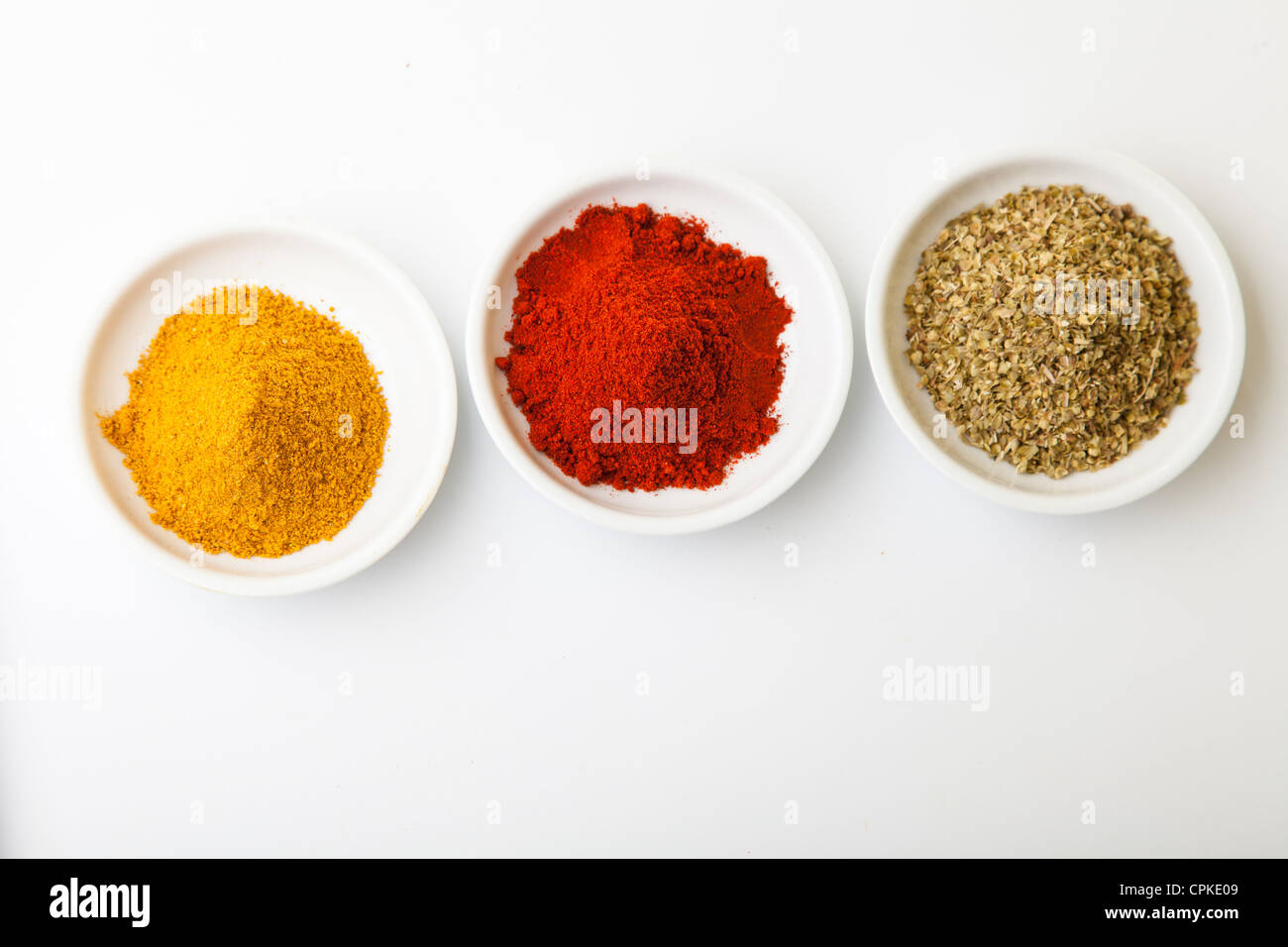 Colorful spices in white pods isolated on white Stock Photo - Alamy