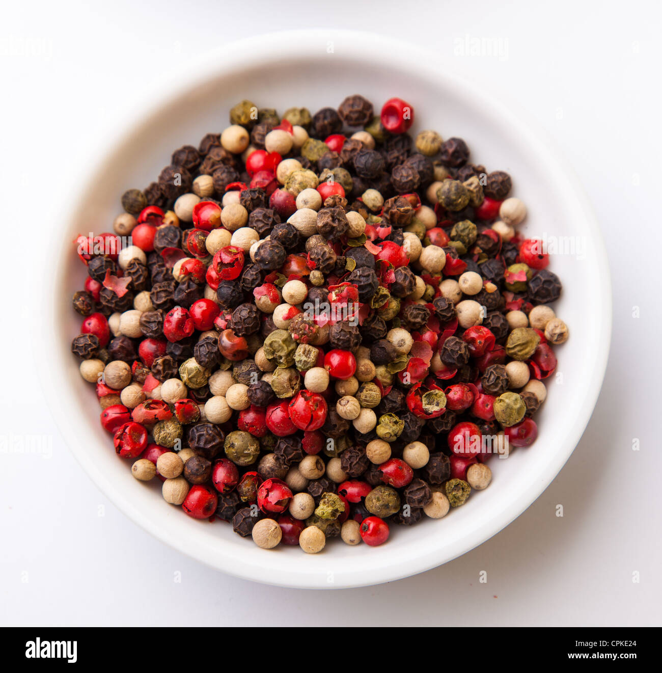 Colorful spices in white pods isolated on white Stock Photo - Alamy