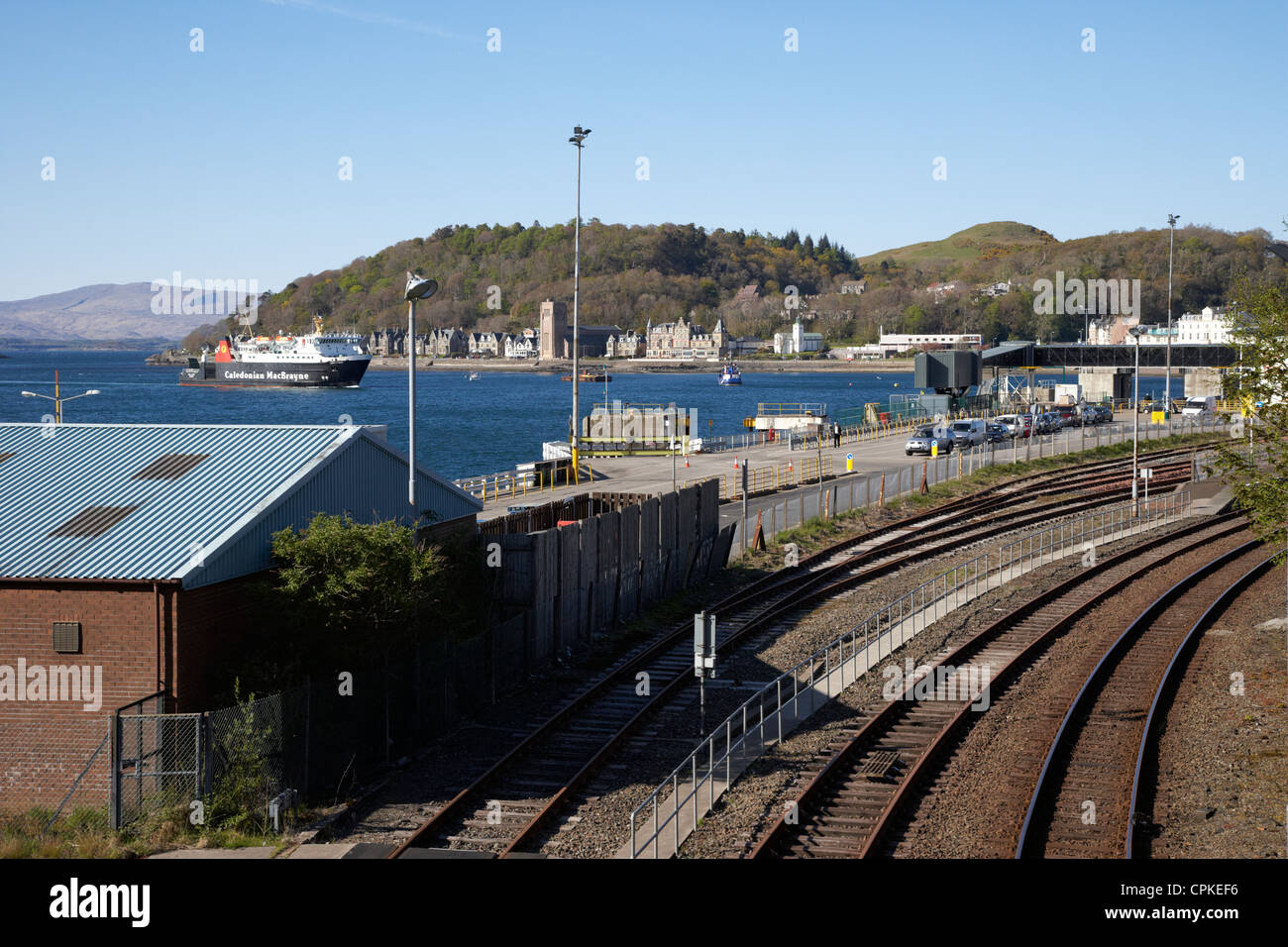 railway track leading into oban with calmac ferry arriving in the ...